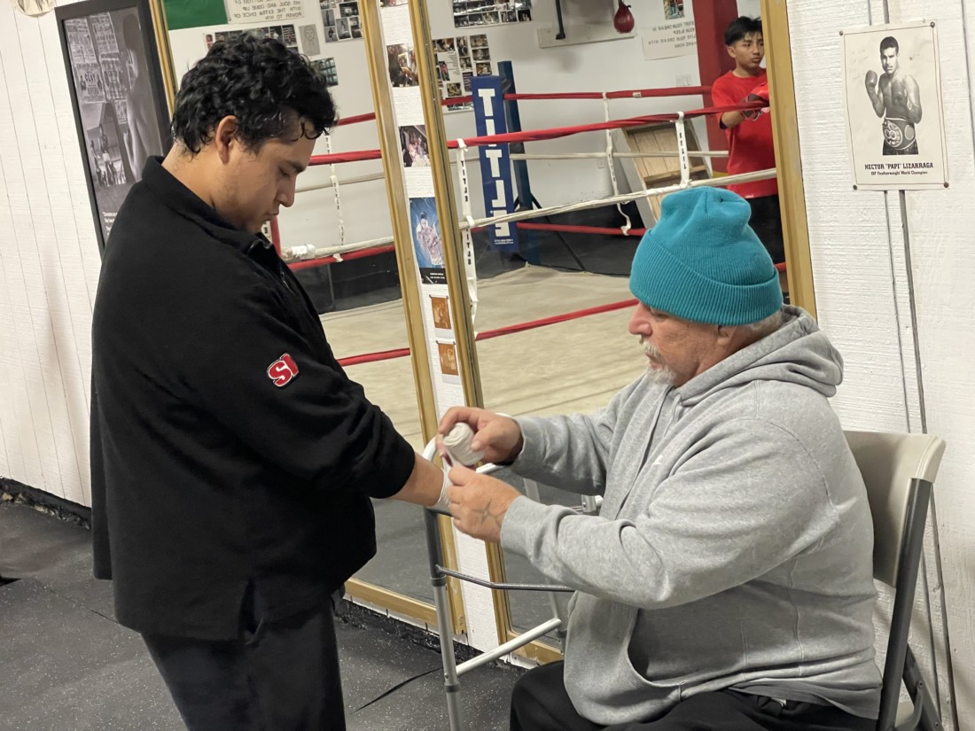 Christian Mendoza getting his hands wrapped by Zeke Lopez. Photo by ...