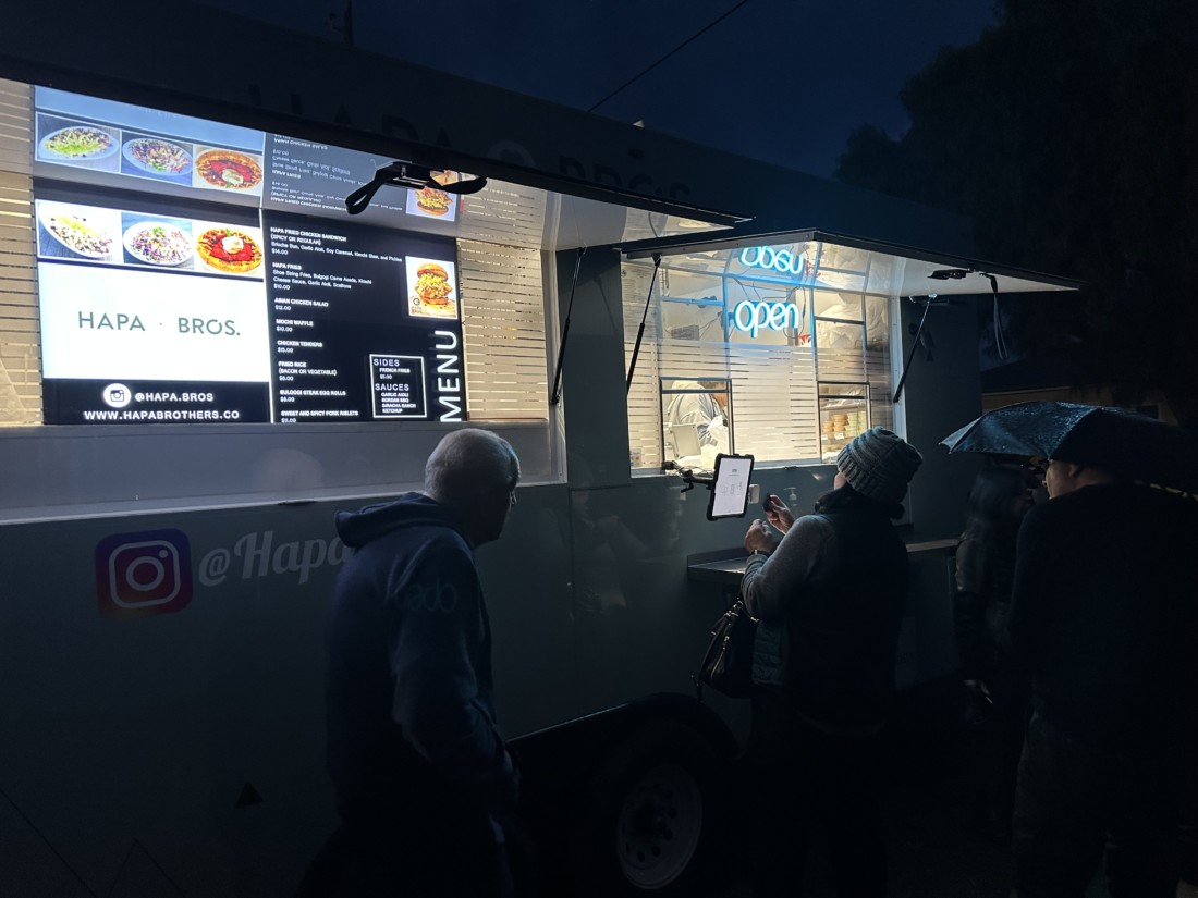 A line of Hapa Bros. customers wait in line to order. Photo by Robert ...